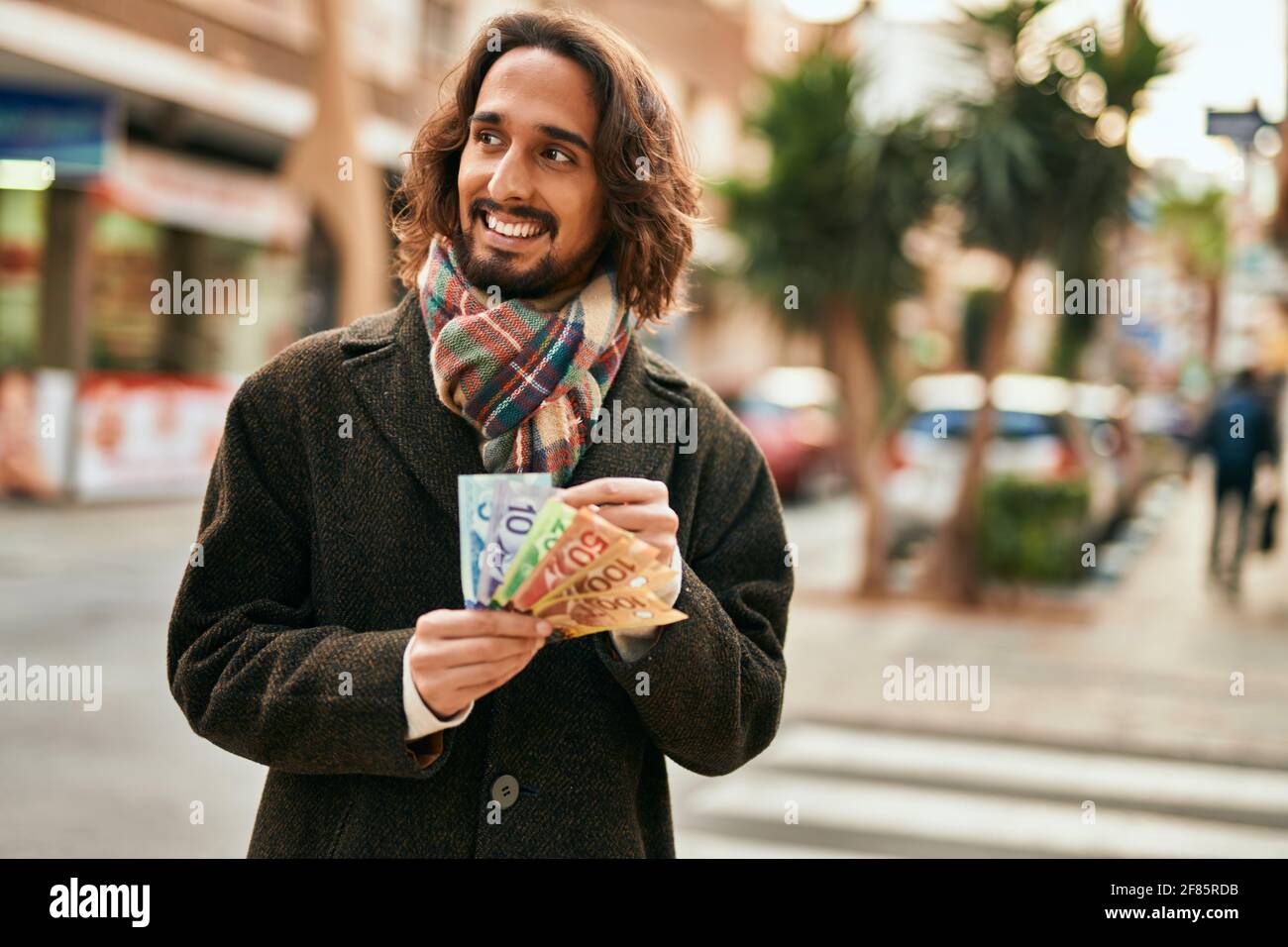 Portrait casual man counting dollars hi-res stock photography and ...