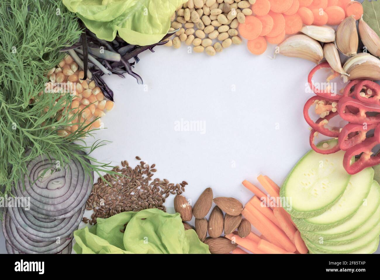 A top view of organic vegetables blank white space in the center for ...