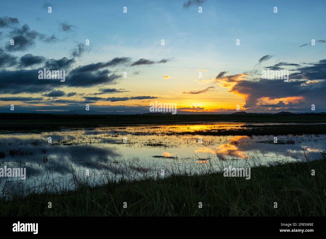 Spectacular fiery sunset over wetlands at Mungalla Station, near Ingham ...