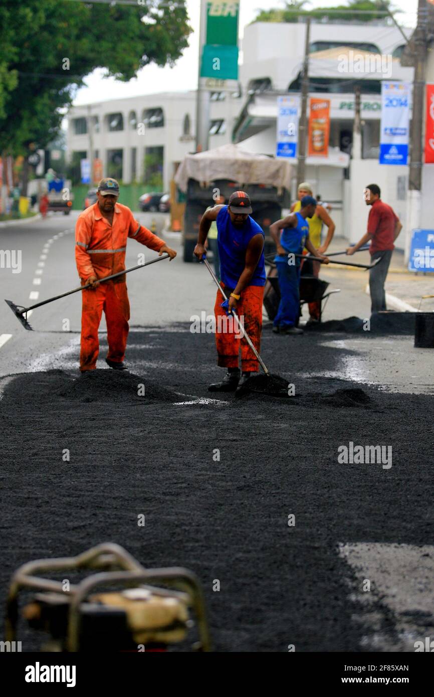 salvador, bahia / brazil - december 29, 2013: Officials make asphalt ...