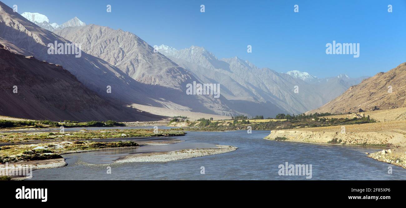 Panj river and hindukush mountains panoramic view. Panj is upper part ...