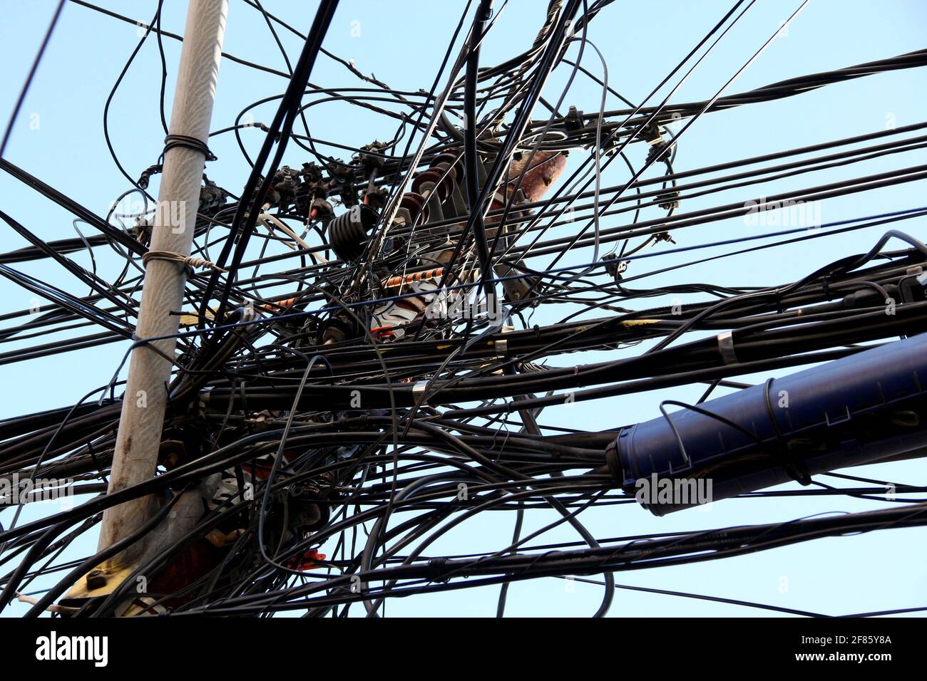 salvador, bahia / brazil - december 12, 2013: A pole loaded with wires ...