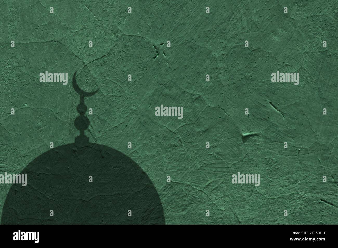 Abstract background of soft green concrete wall and shadow of mosque ...