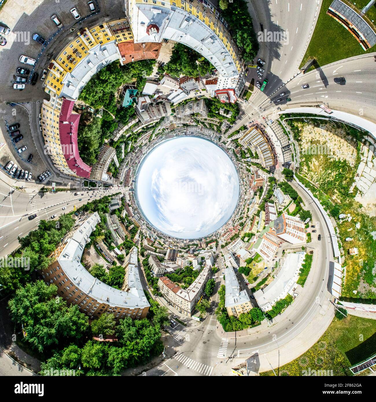 Aerial city view with crossroads and roads, houses, buildings, parks ...