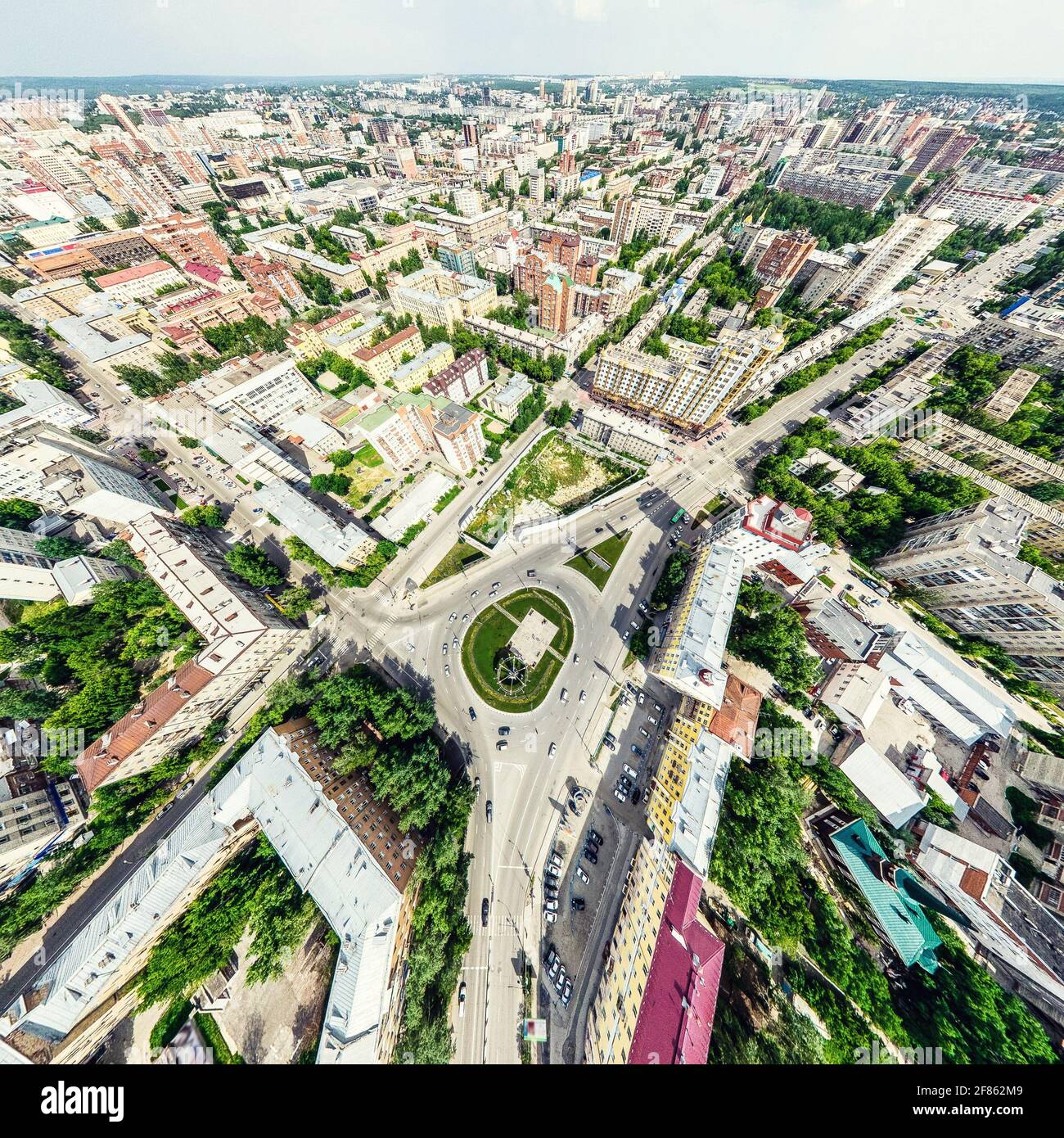 Aerial city view with crossroads and roads, houses, buildings, parks ...