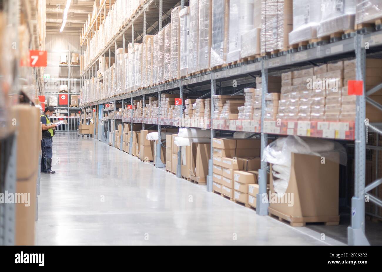 The storage warehouse of the cardboard boxes put on the stainless steel ...