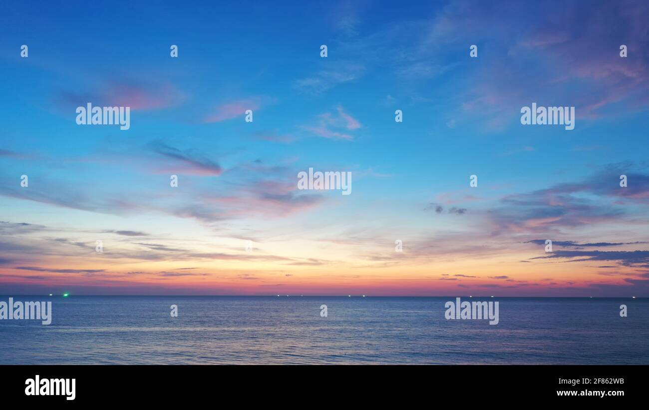Beautiful sunset over the clam sea with cloud sky background. Sunset ...