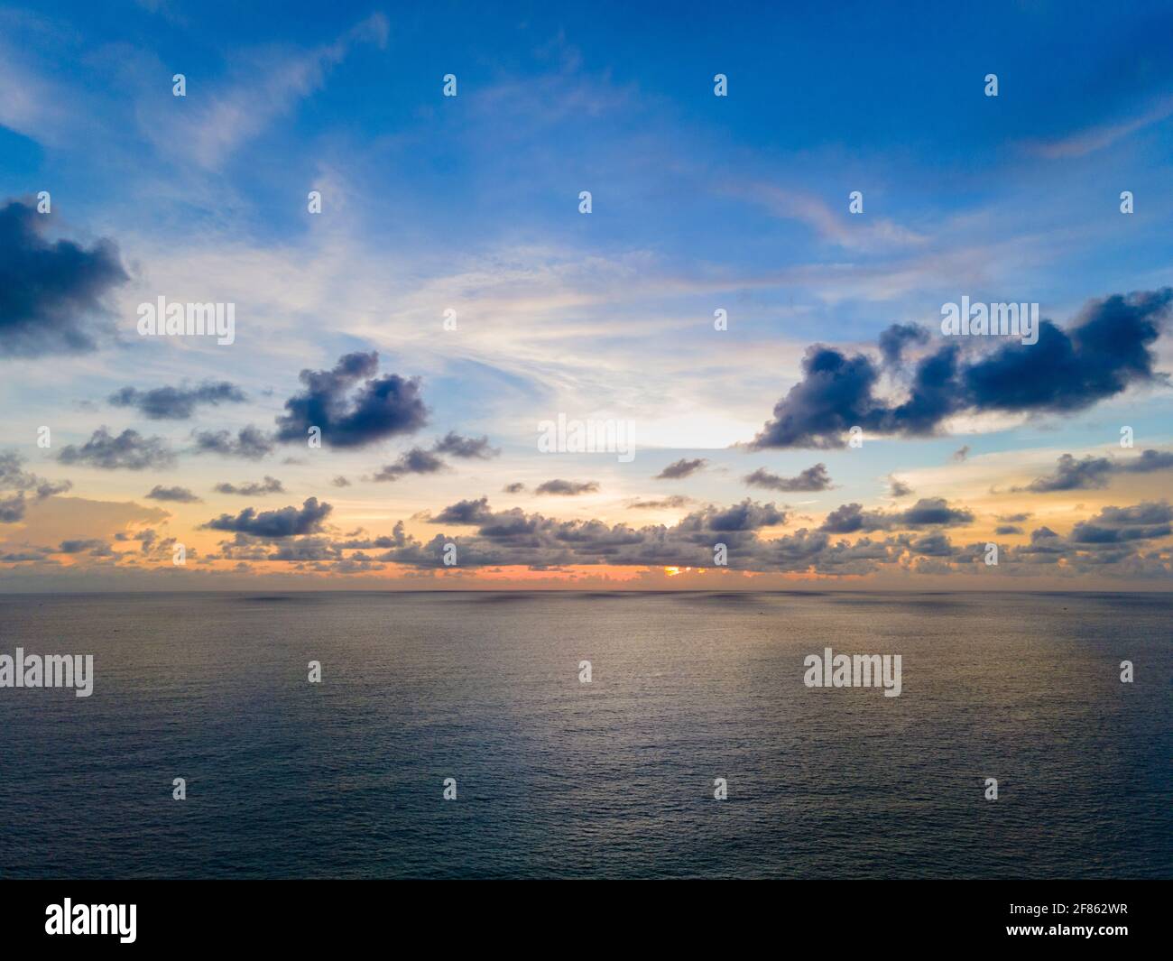 Beautiful sunset over the clam sea with cloud and sky background ...