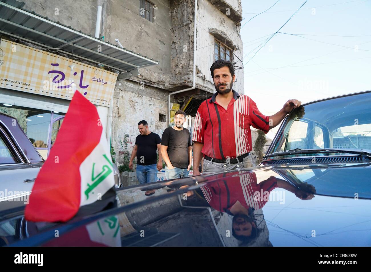 Man poses near car in hi-res stock photography and images - Alamy