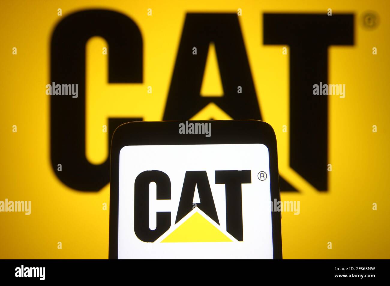 In this photo illustration the Caterpillar logo is seen on a smartphone ...