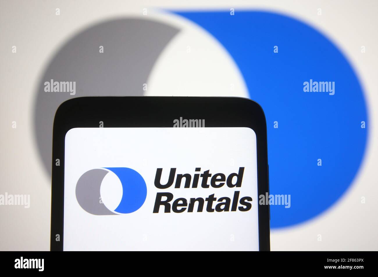 In this photo illustration the United Rentals logo is seen on a ...
