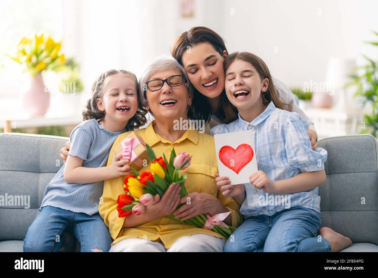 Happy mother's day! Child daughters and mother are congratulating ...