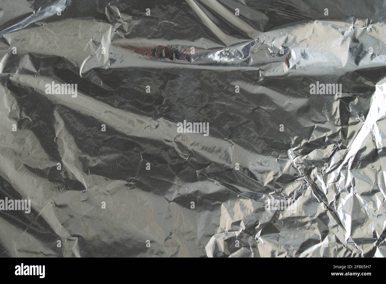 Crumpled foil texture. Crumpled paper is shiny with a color tint Stock ...