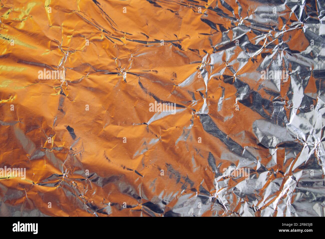 Crumpled foil texture. Crumpled paper is shiny with a color tint Stock ...