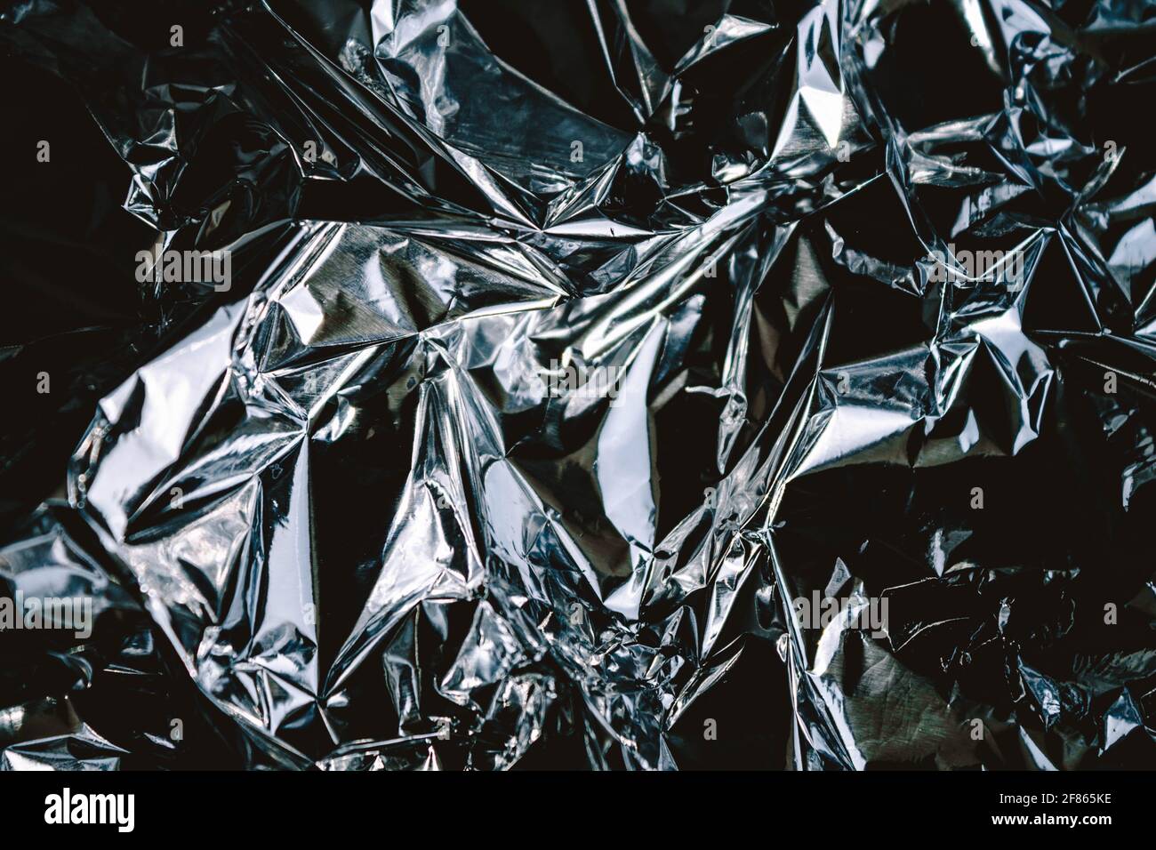 Crumpled foil texture. Crumpled paper is shiny with a color tint Stock ...
