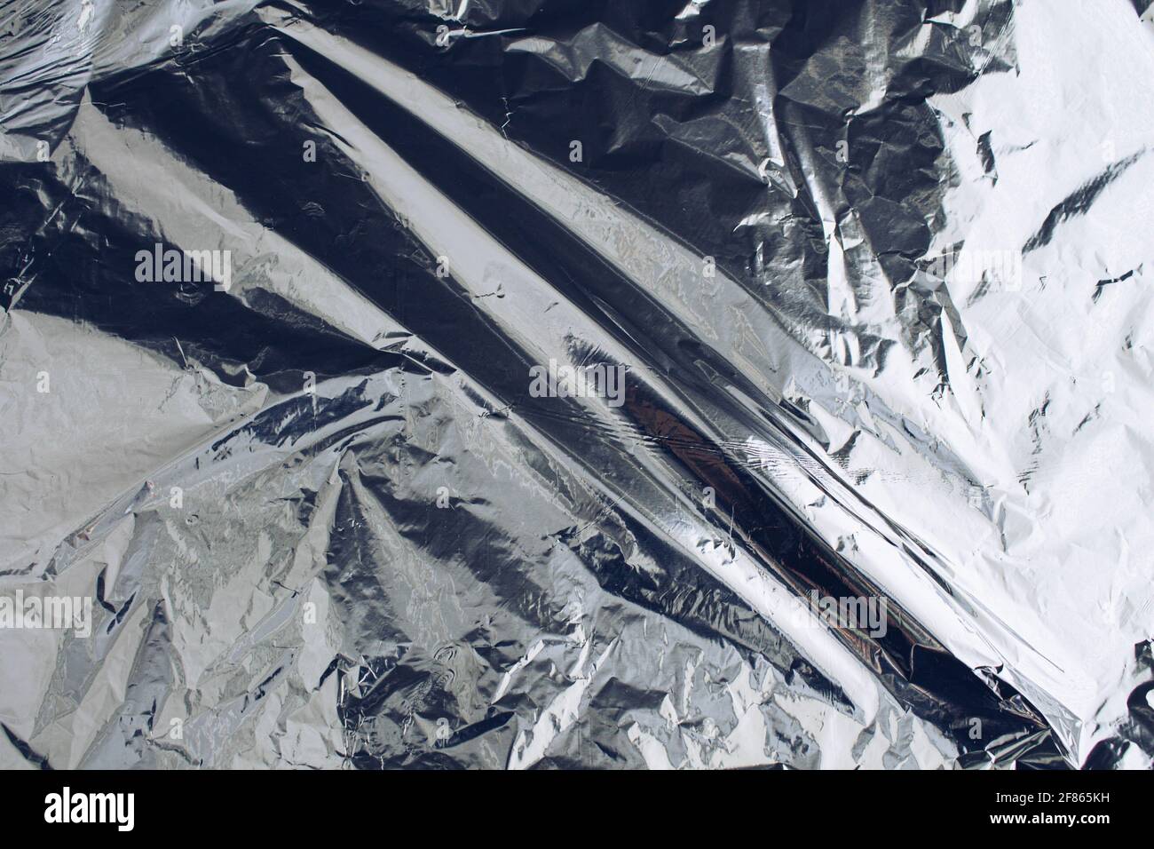 Crumpled foil texture. Crumpled paper is shiny with a color tint Stock ...
