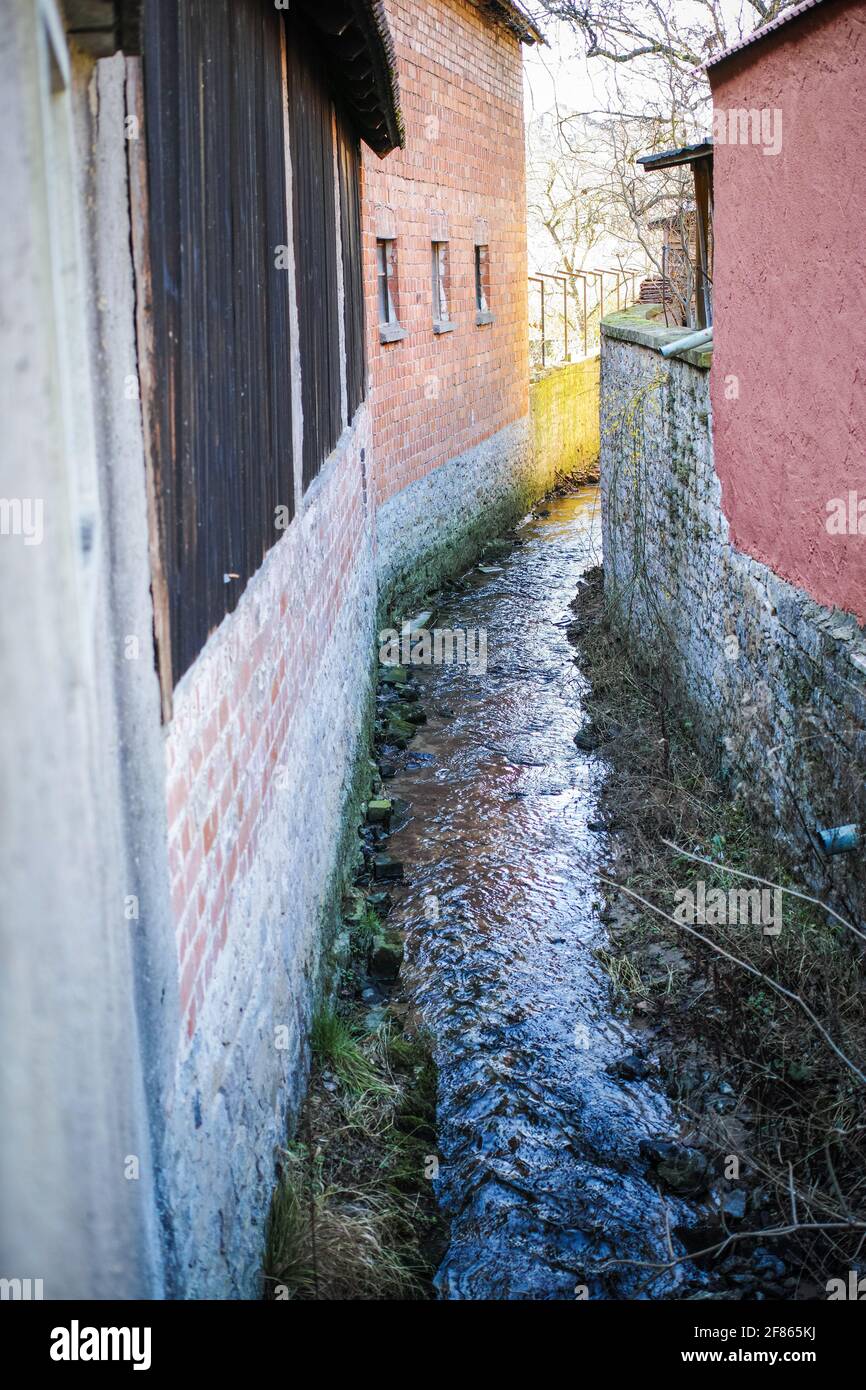 Stream flowing between buildings hi-res stock photography and images ...