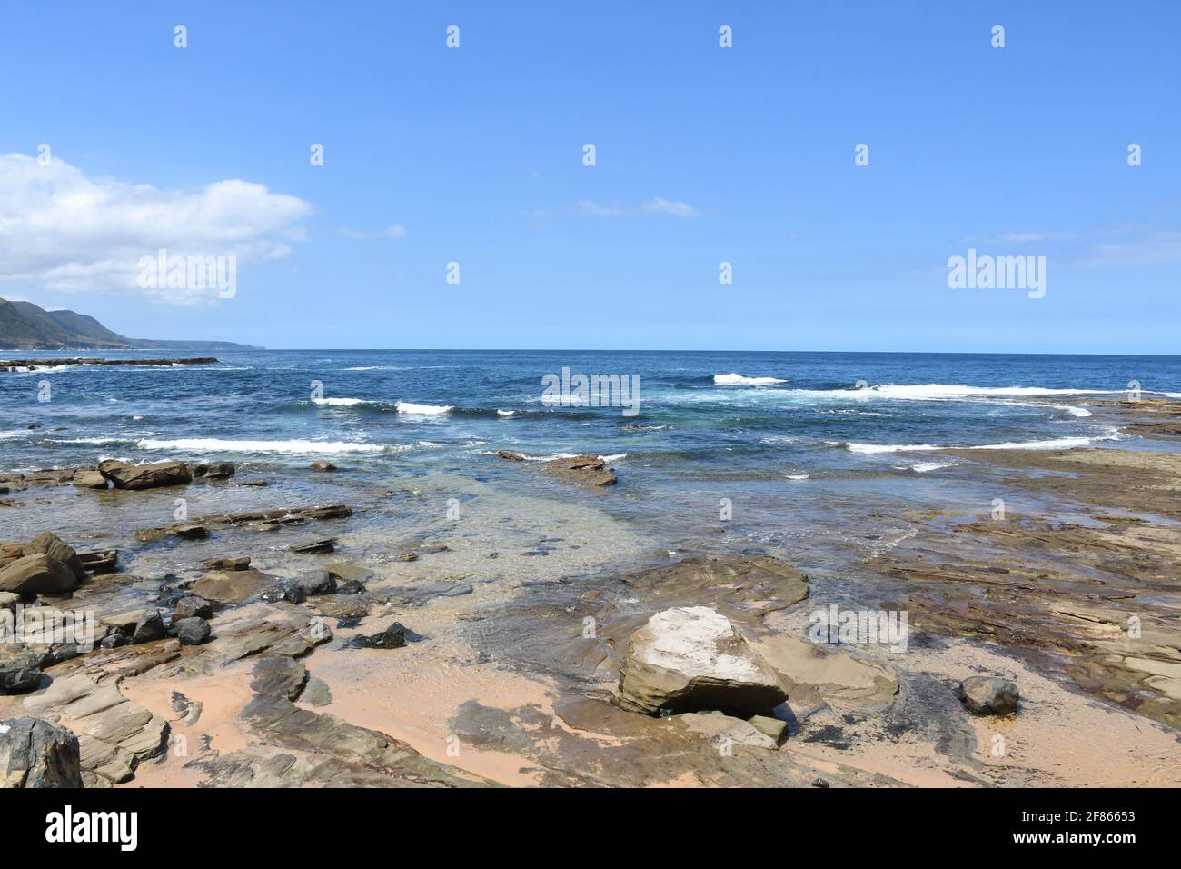 Majestic wavy seascape in Australia at daytime under a cloudy blue sky ...