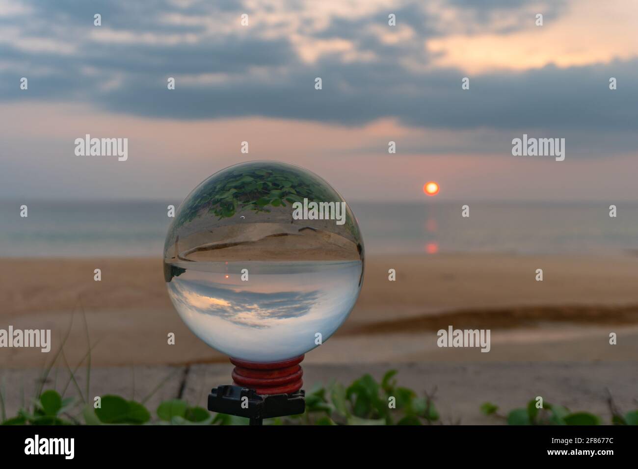 sunset in crystal ball the image that appears in an upside-down looks ...