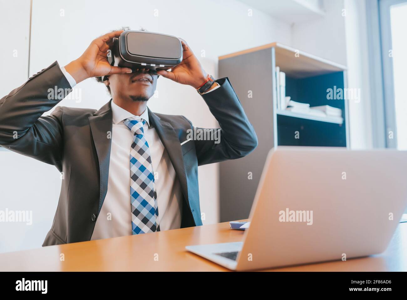 Businessman using virtual reality glasses Stock Photo - Alamy