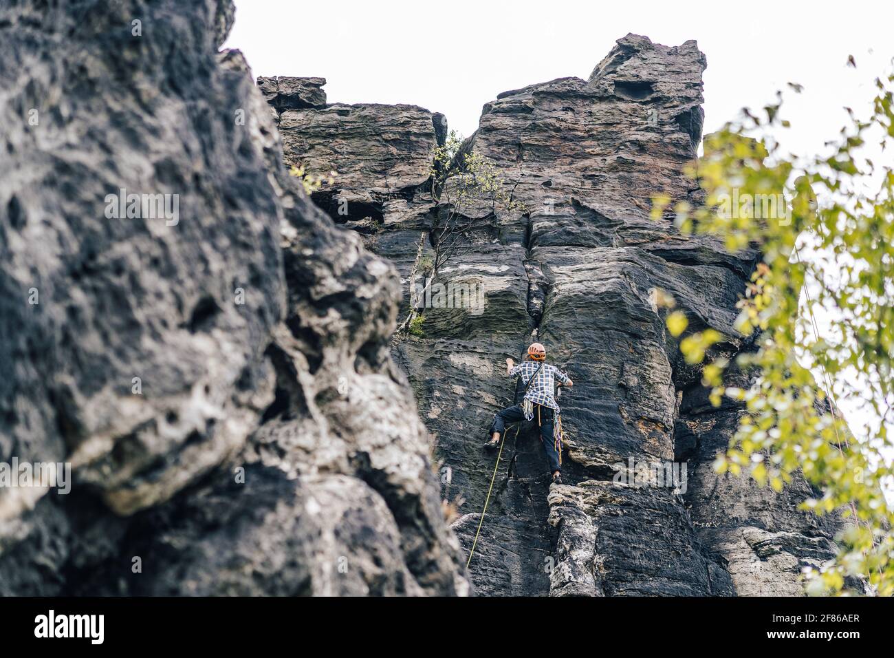 Rock climbing on sadnstone towers in Czechia Stock Photo - Alamy