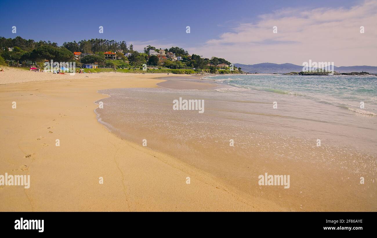 Blue sea and sandy shore on a sunny day Stock Photo - Alamy