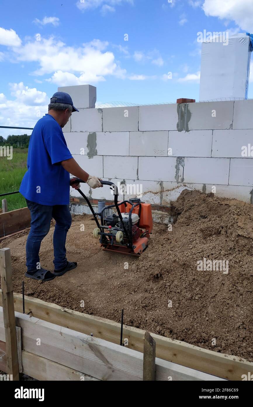 Use of a vibrating plate on construction, heavy construction tools and ...