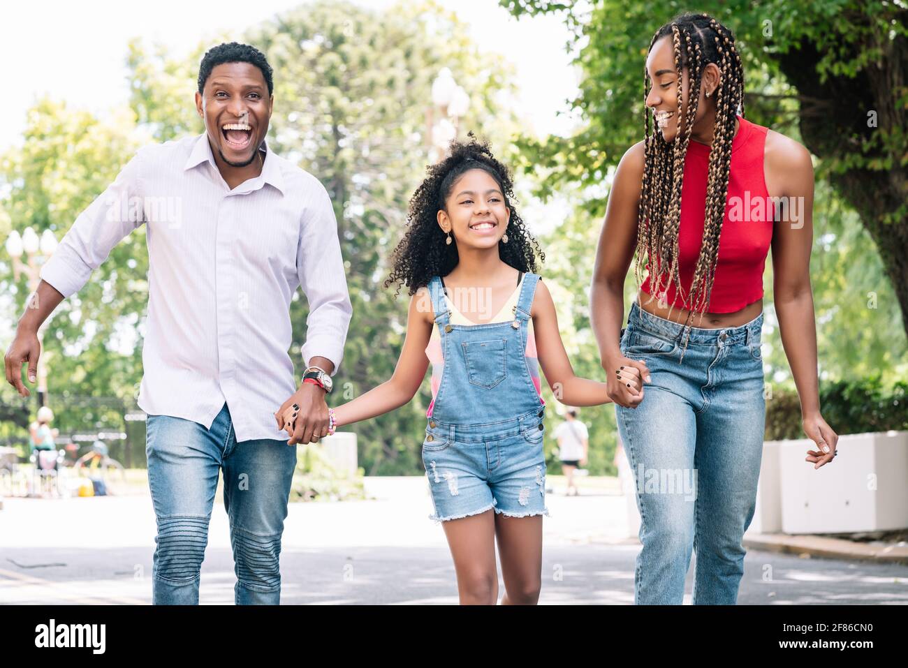 Family enjoying a walk together outdoors Stock Photo - Alamy