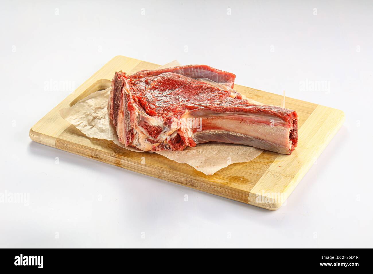 Raw bones for cooking over board isolated Stock Photo - Alamy