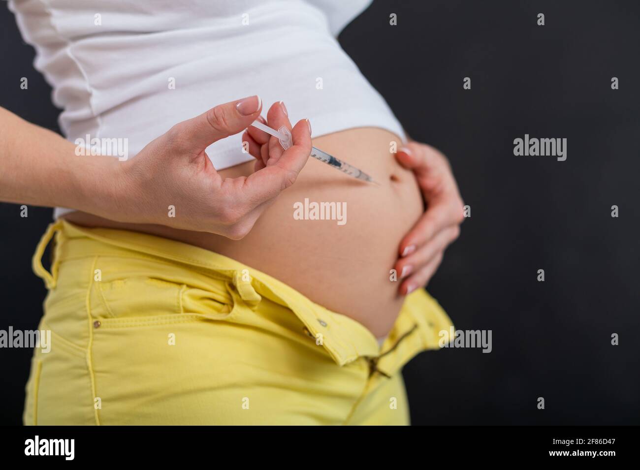 Injection stomach girl hi-res stock photography and images - Alamy