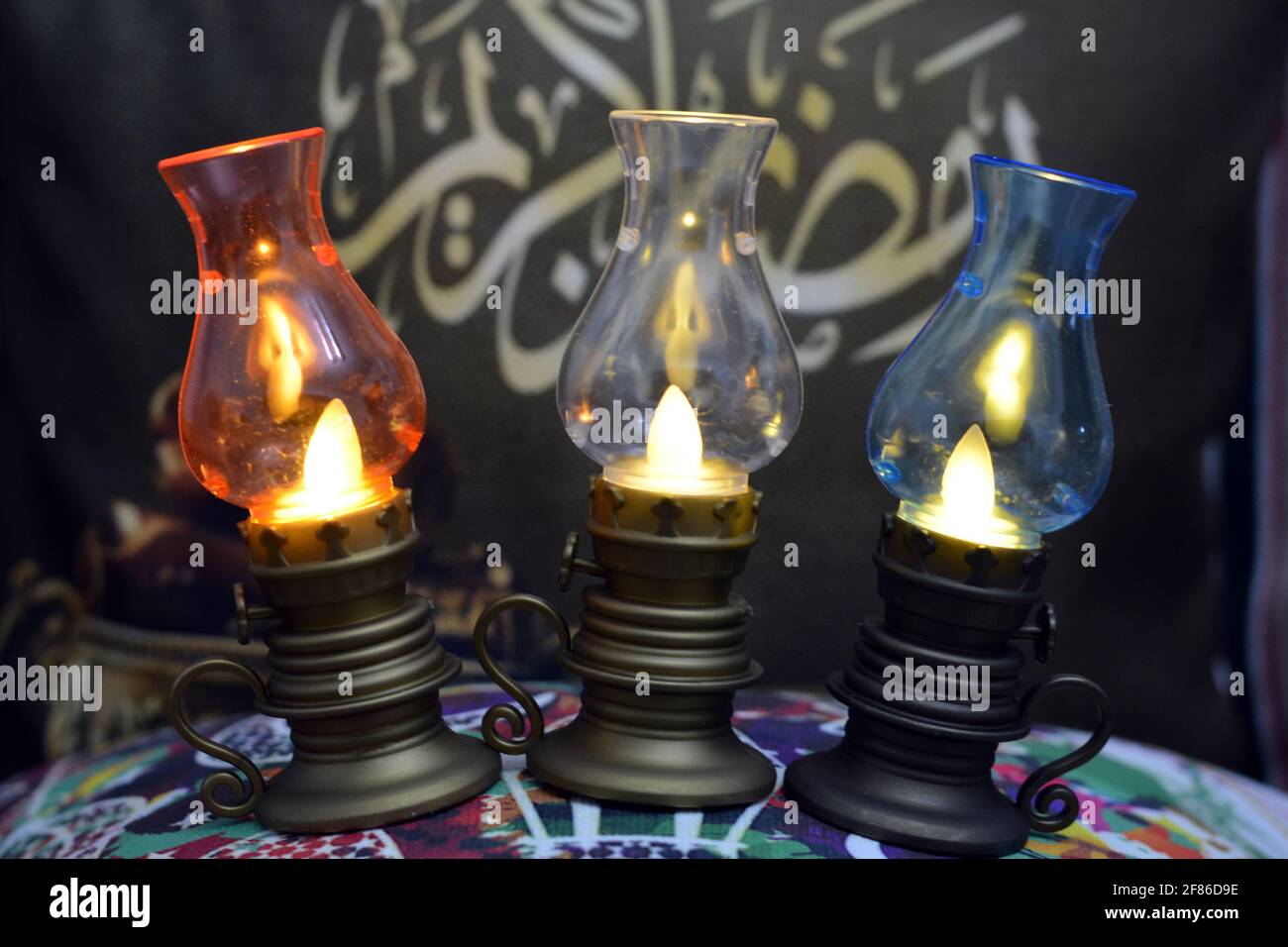 Ramadan lanterns Fanoos oil lamps with blurred background of Arabic ...