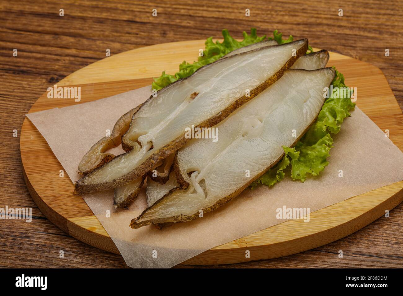 Delicous smoked halibut fish slices snack Stock Photo - Alamy