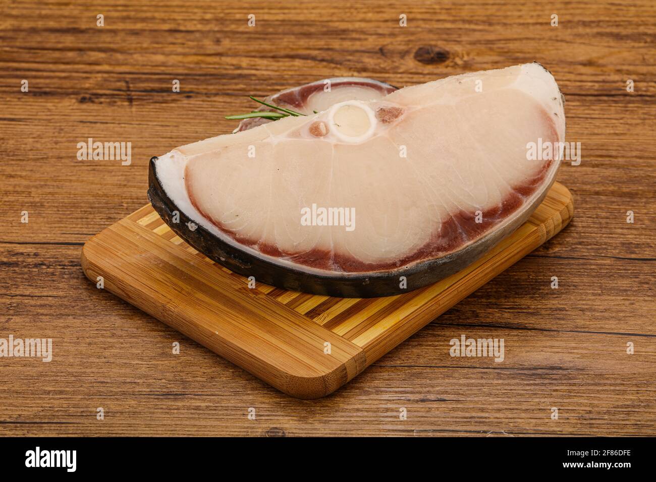 Raw shark steak served rosemary for cooking Stock Photo - Alamy