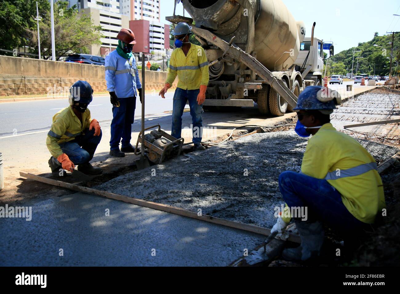salvador, bahia, brazil - december 9, 2020: masons work on the ...
