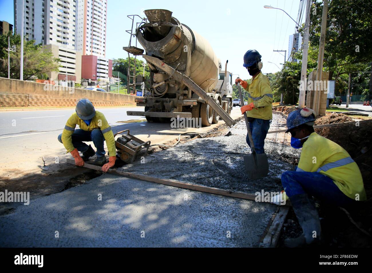 salvador, bahia, brazil - december 9, 2020: masons work on the ...