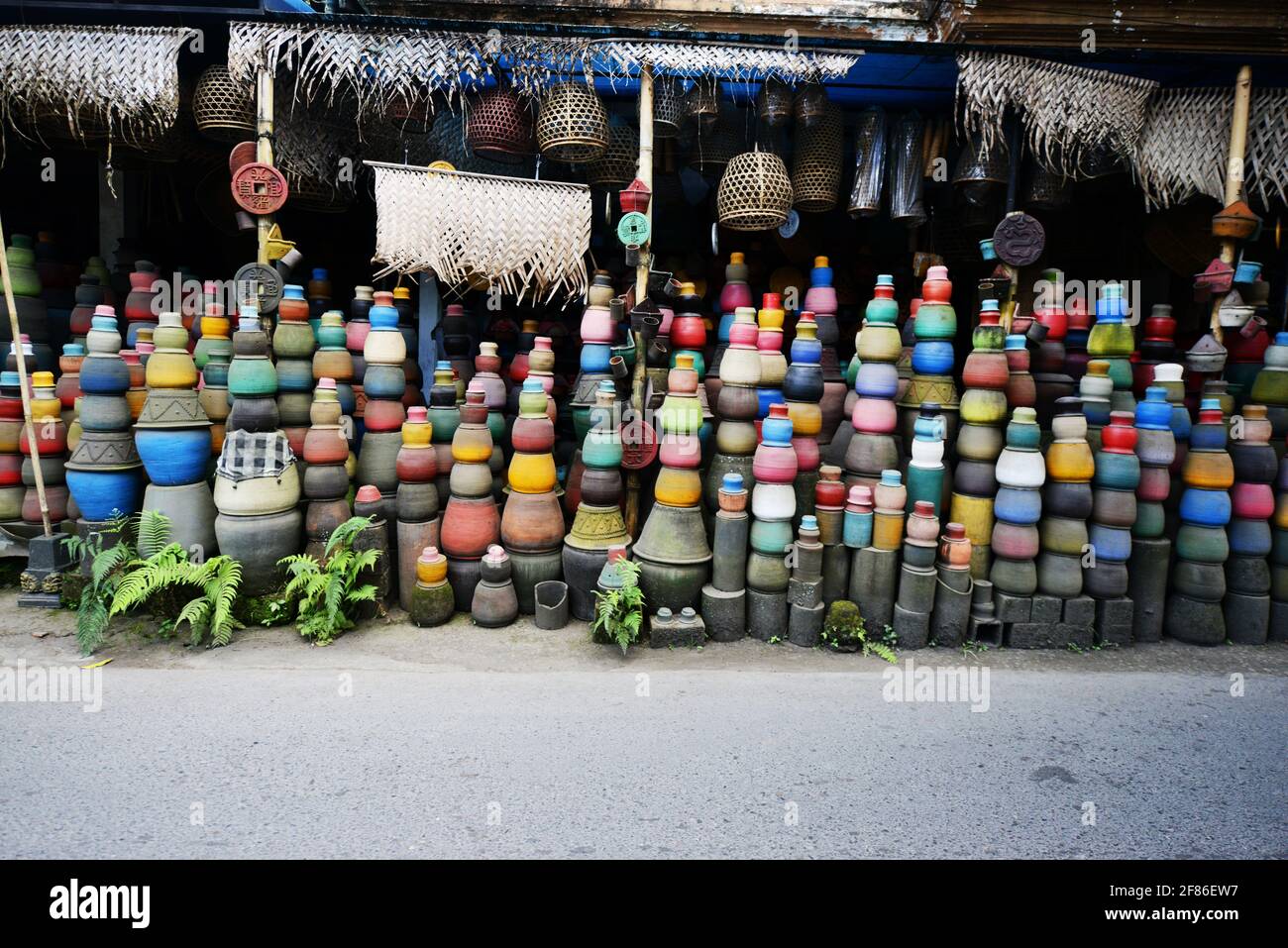 Roadside display of colourful pottery craftsmanship in Ubud, Bali Stock ...