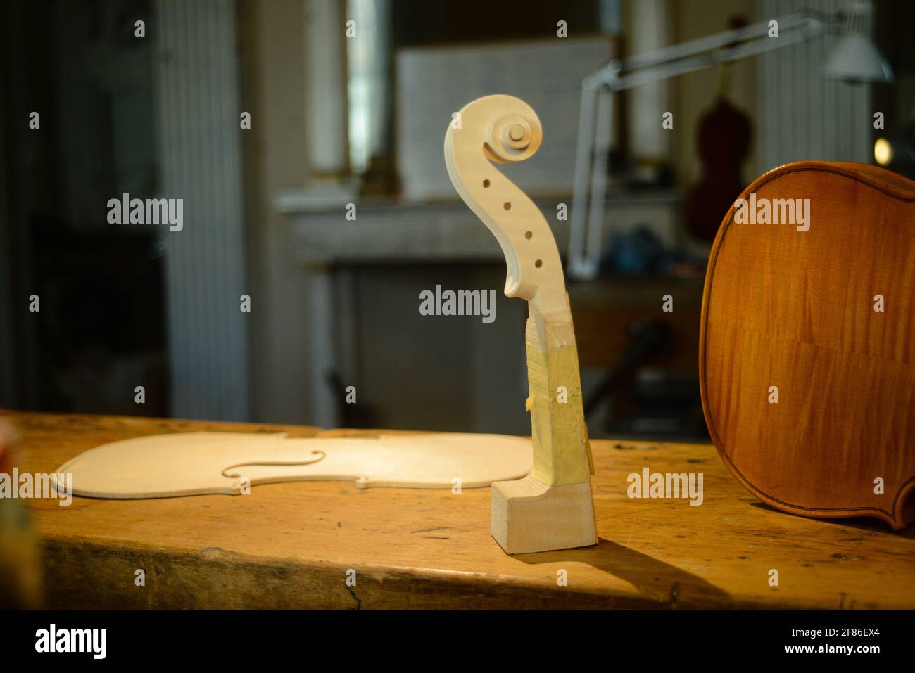 Vertical shot of a violin detail in the master workshop Stock Photo - Alamy