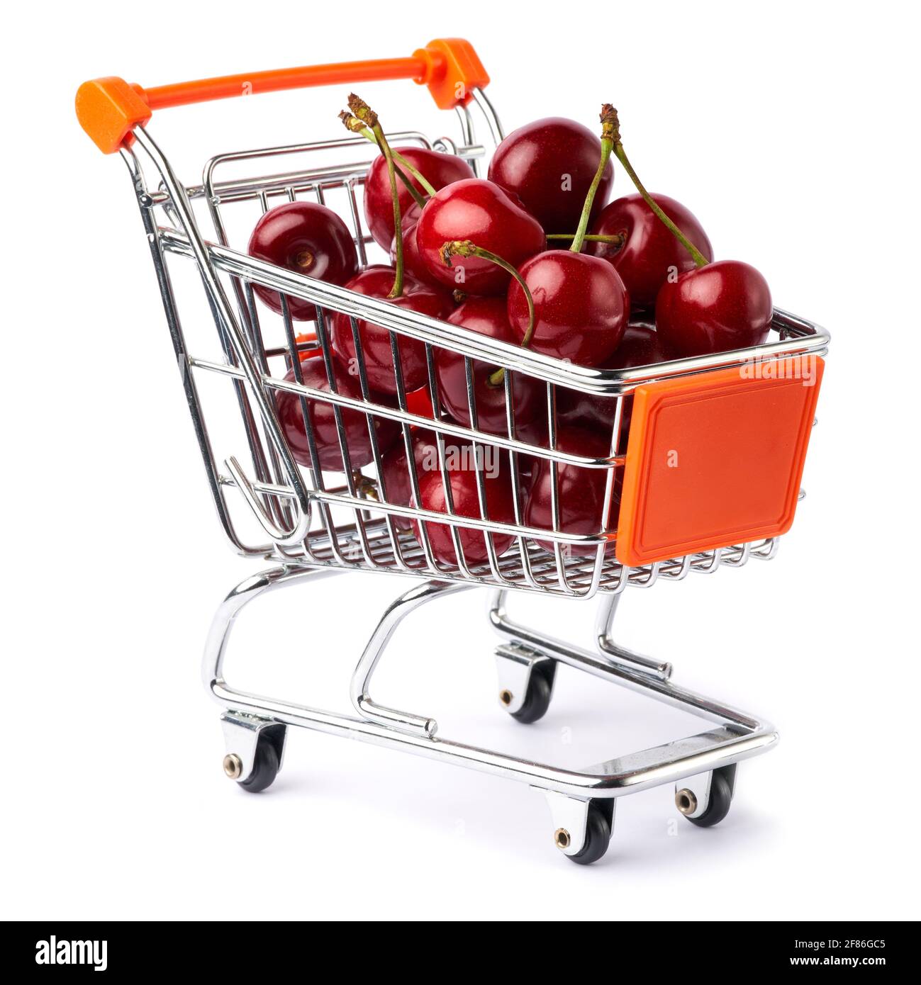 shopping cart trolley full of sweet cherry fruits isolated on white ...