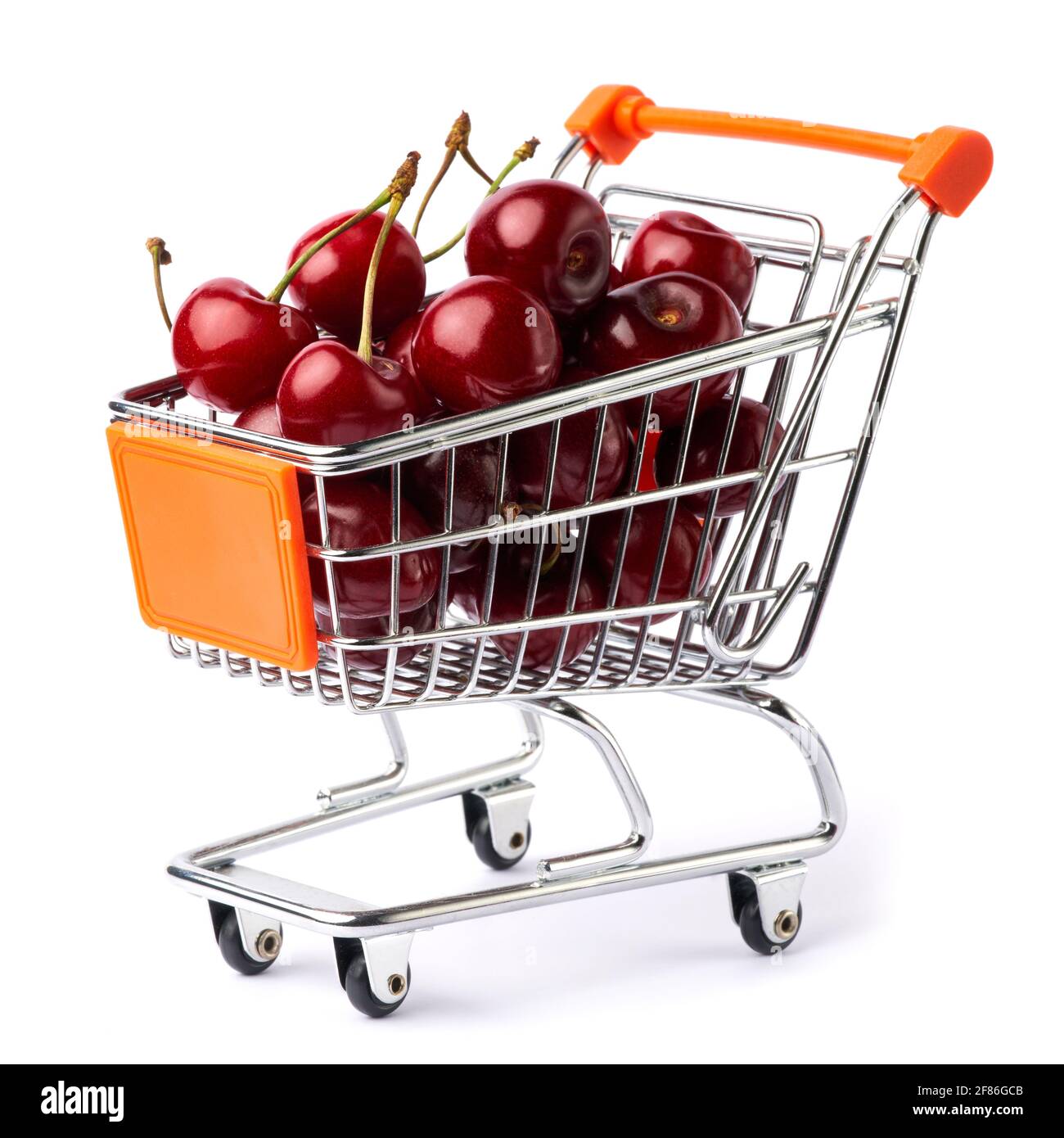 shopping cart trolley full of sweet cherry fruits isolated on white ...