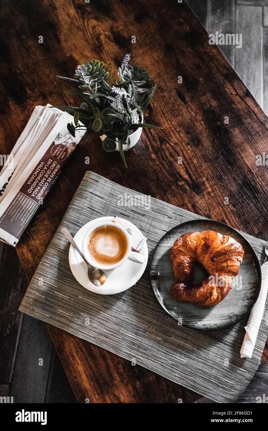 VALENCIA, SPAIN - Mar 31, 2021: Full breakfast at an oak table, with ...