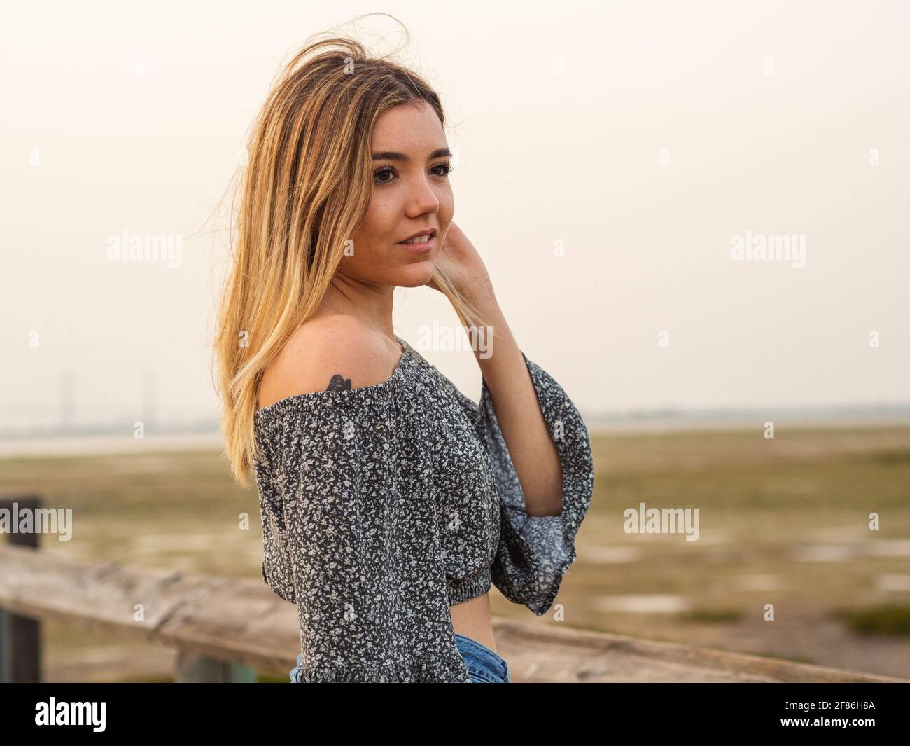 Pretty Spanish girl wearing an ornamented gray blouse and posing in the ...