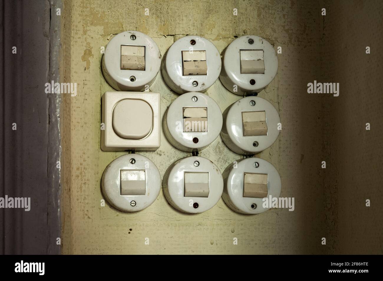 Closeup of nine old light switches in a derelict house Stock Photo - Alamy