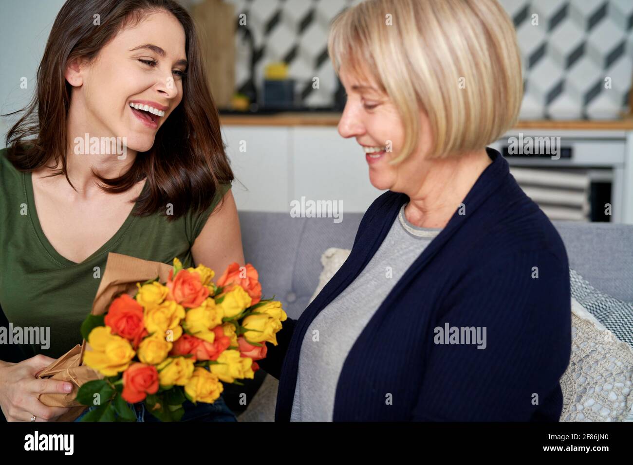 Woman giving present mother hi-res stock photography and images - Alamy