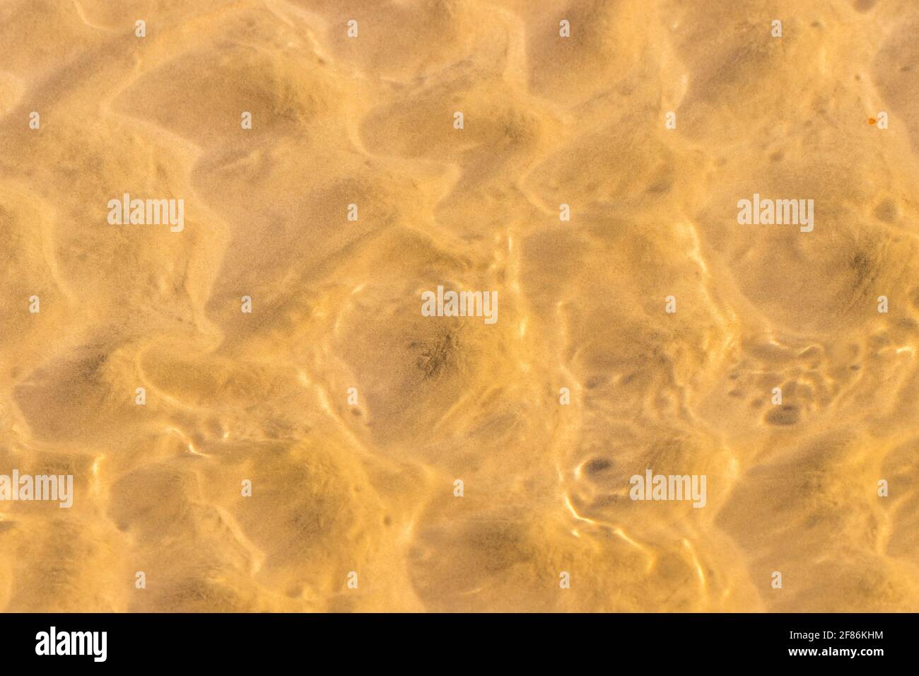 Top view of the golden sand and transparent water Stock Photo - Alamy