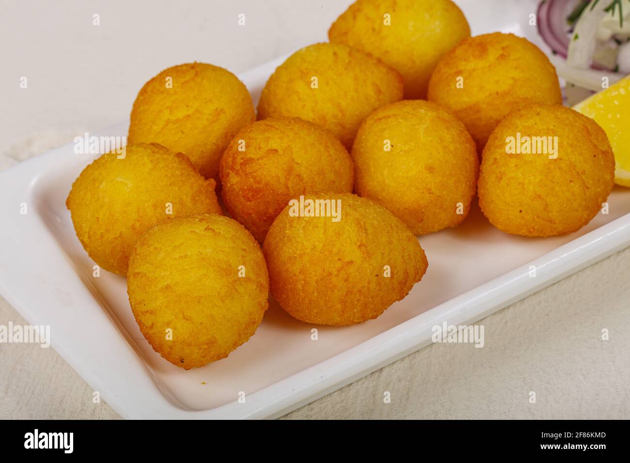 Tasty hot crispy fried potato balls Stock Photo - Alamy