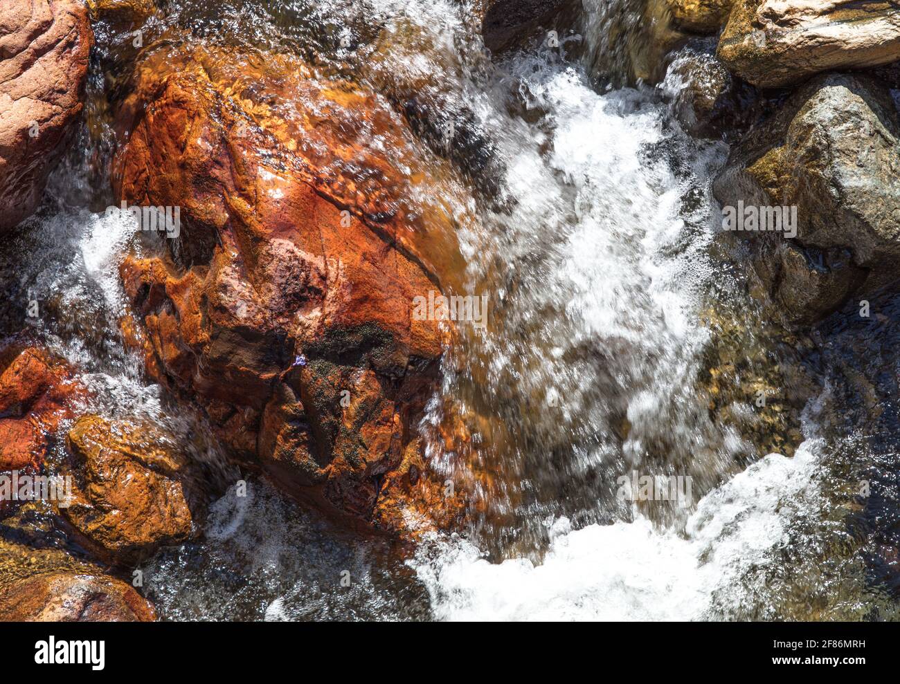 Top view of the mountain river with clean water flowing on the rocks ...