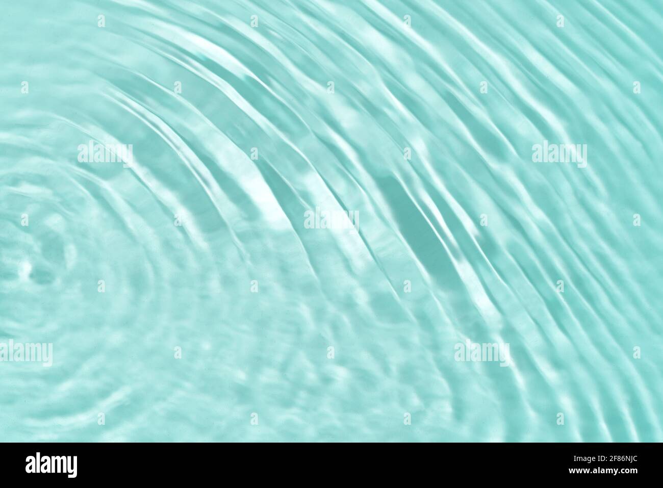 Clear water surface close up. Blue clean water with ripple effect, top ...