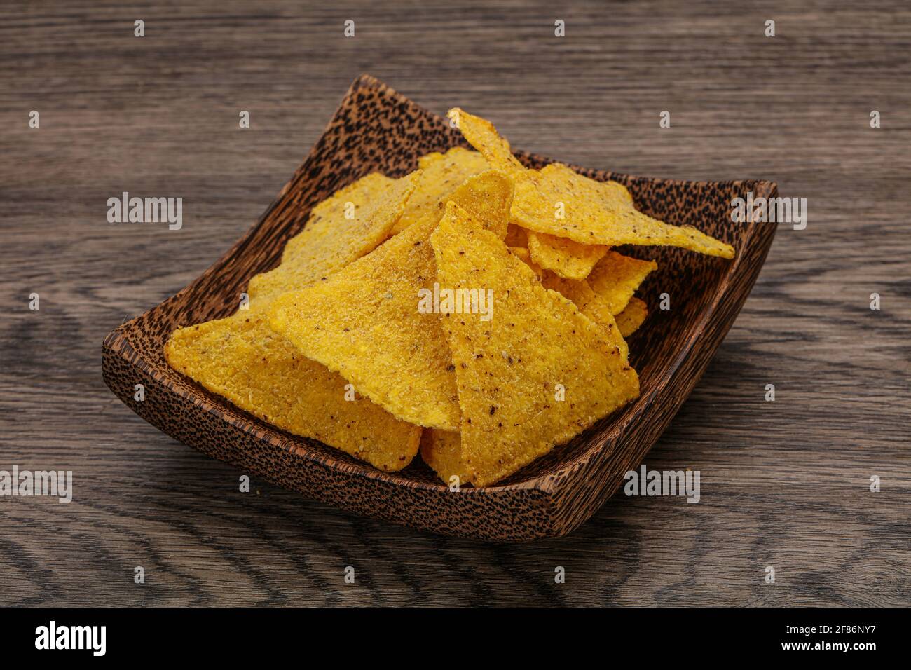 Mexican crunchy corn nachos triangle heap Stock Photo - Alamy