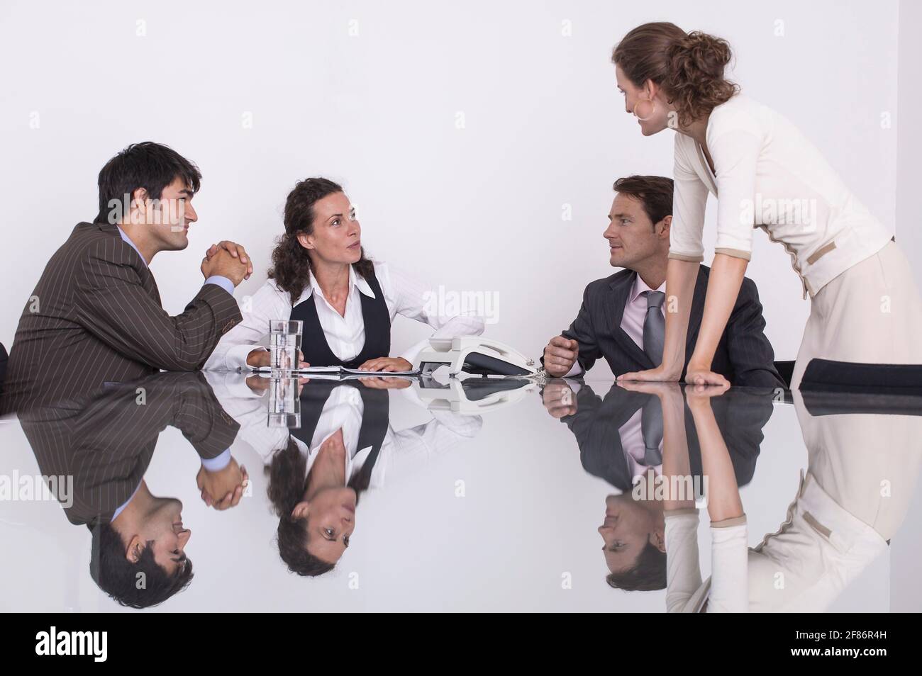 Business people talking in conference room meeting Stock Photo - Alamy