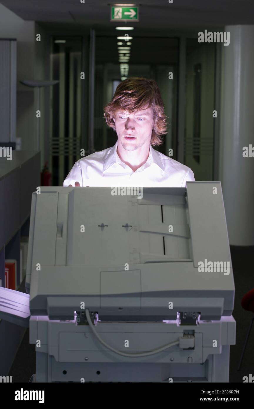 People using photocopier hi-res stock photography and images - Alamy
